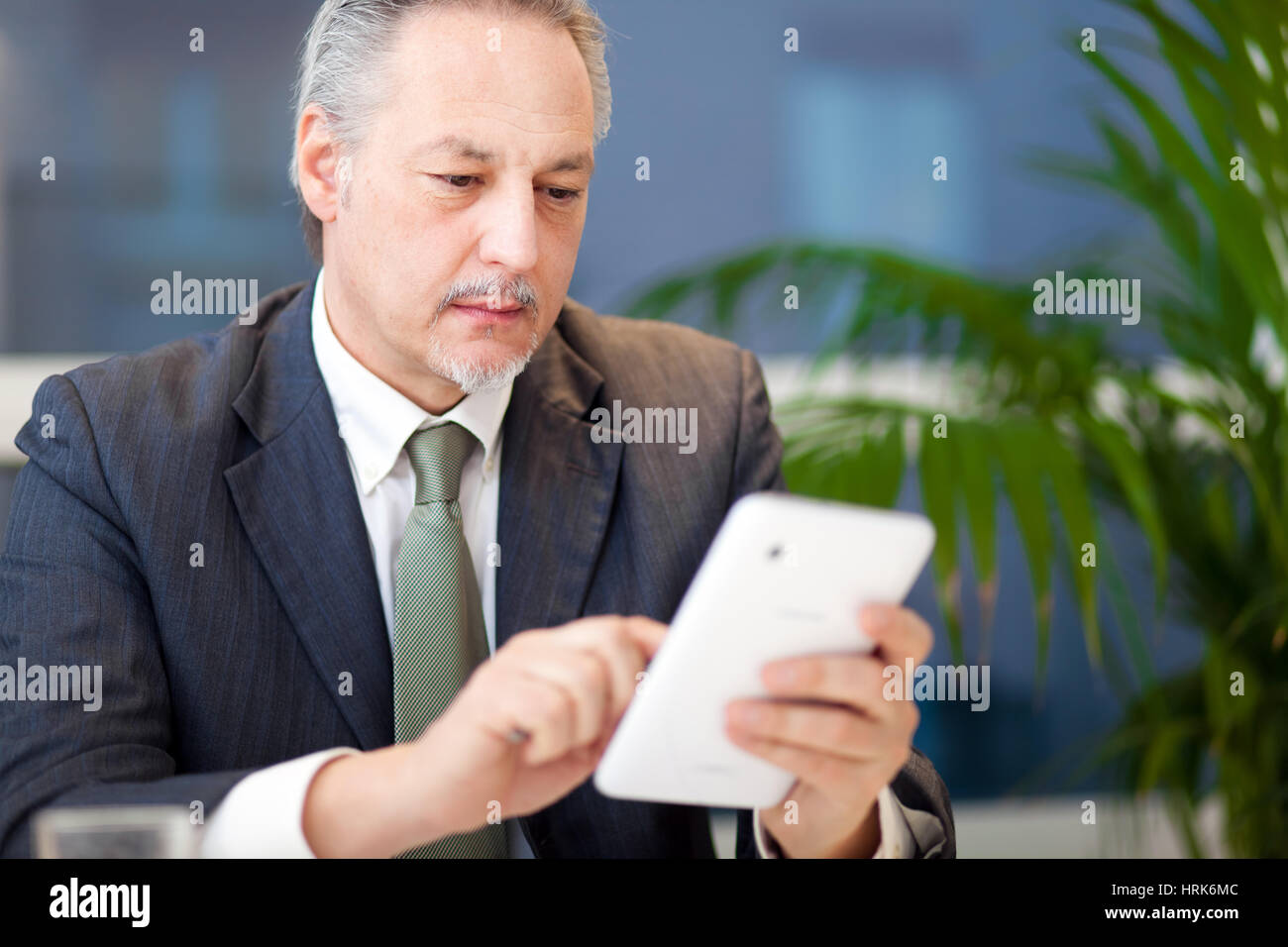 Happy secretary using tablet computer hi-res stock photography and ...