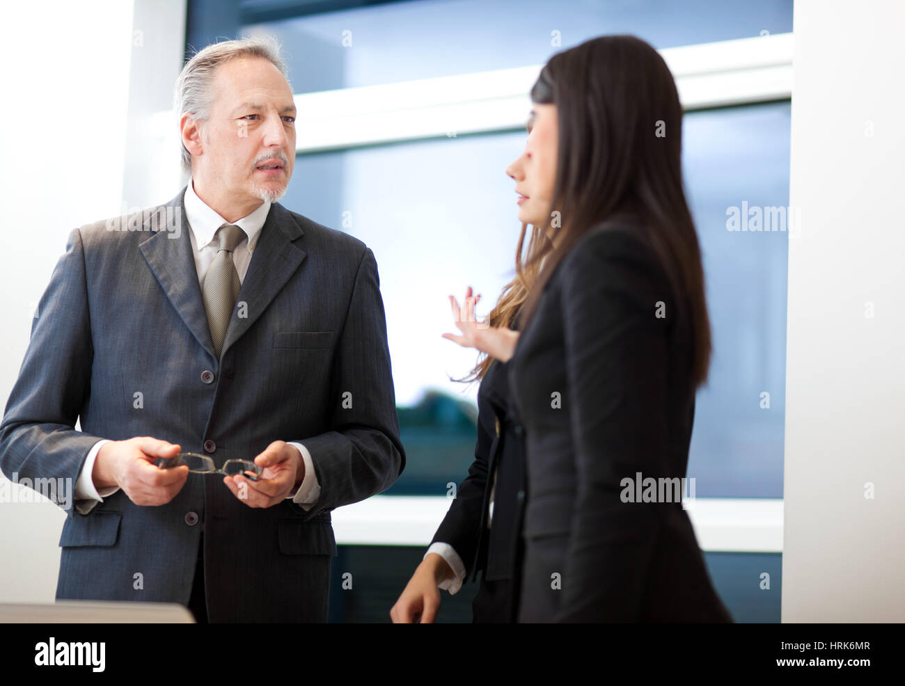 Business people talking Stock Photo - Alamy