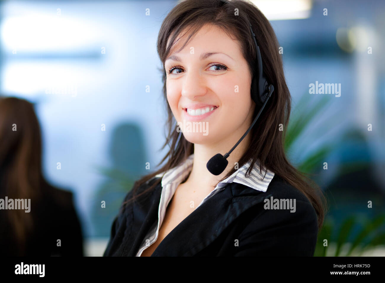 Portrait of a beautiful girl with headset Stock Photo - Alamy