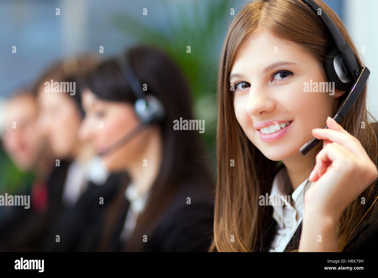 Smiling customer representative at work Stock Photo - Alamy