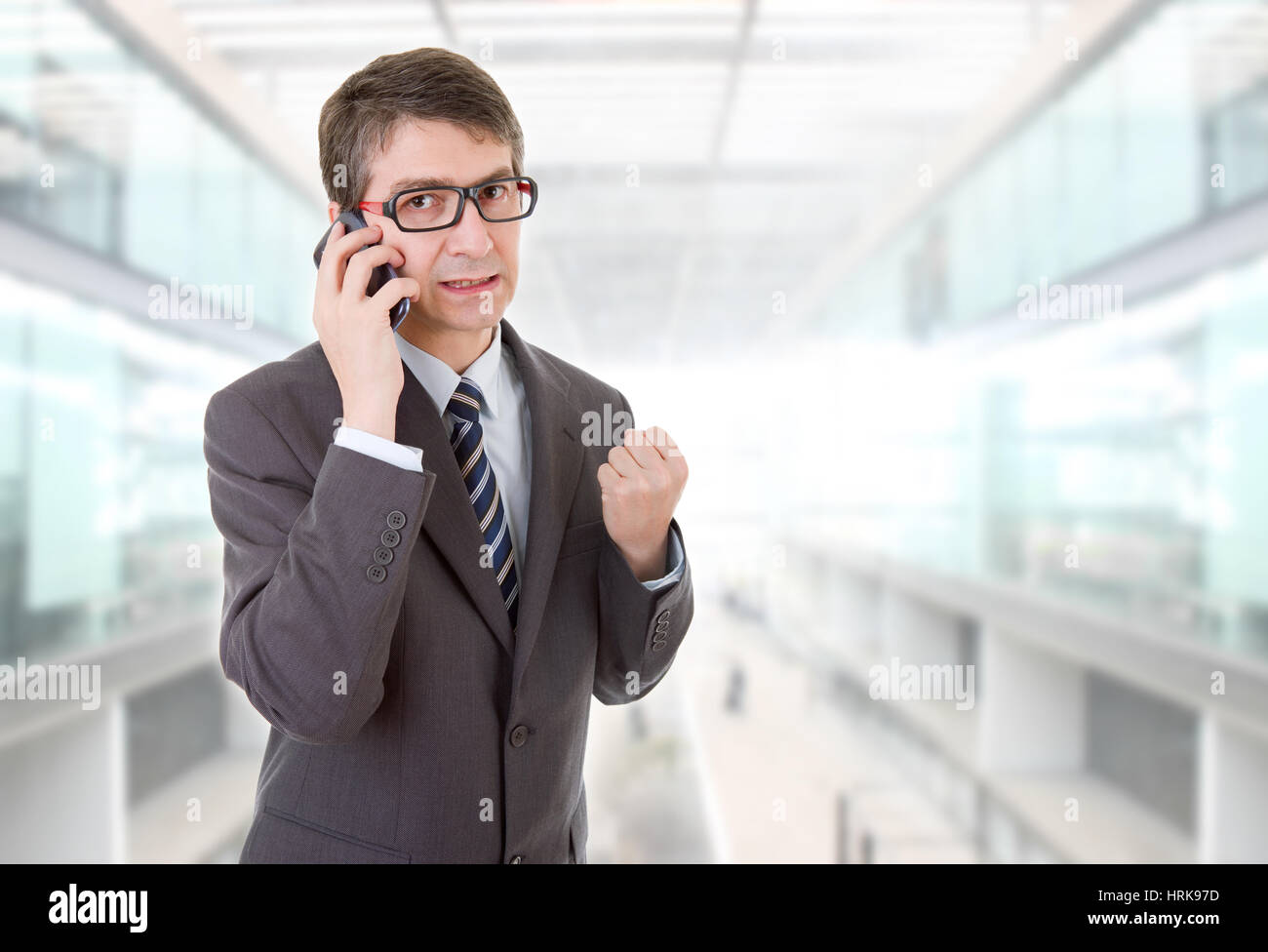 happy business man winning on the phone, at the office Stock Photo - Alamy