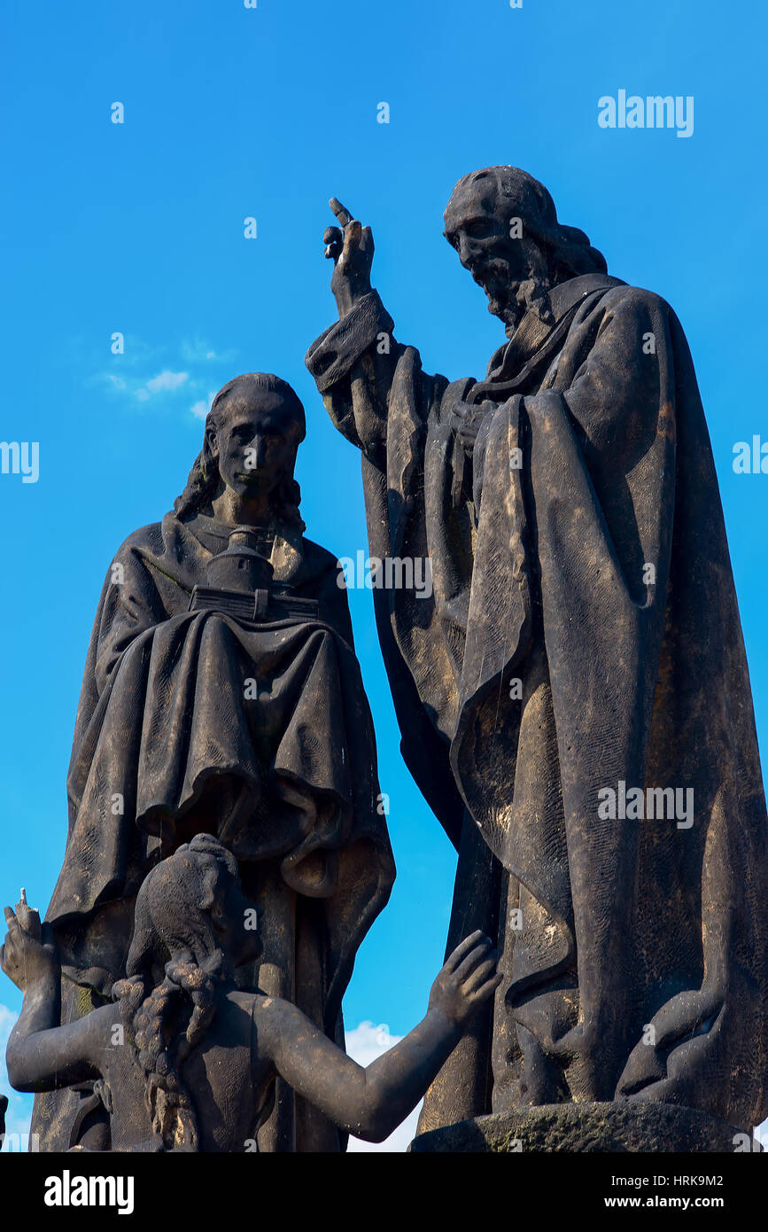 Baroque Statues on the Charles Bridge with beautiful Prague Castle and ...