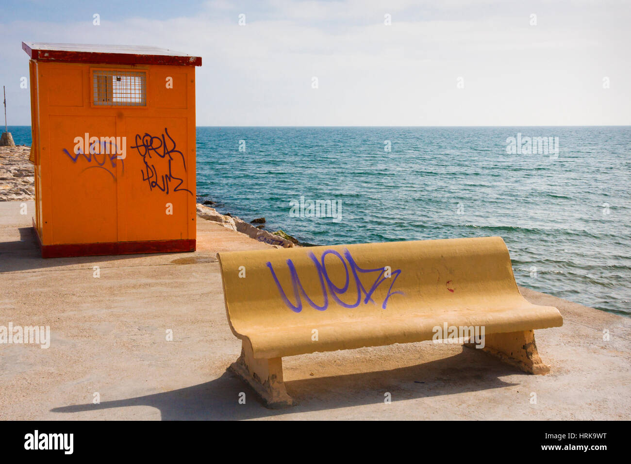 Graffiti on bench and hut on beachfront, Sitges, Catalonia, Spain ...