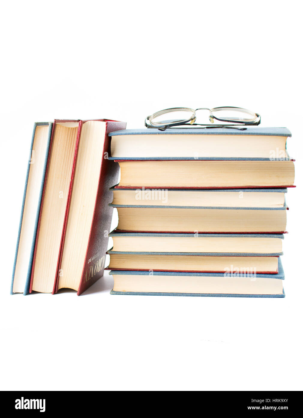 pile of old books stacked on top of each other isolated Stock Photo - Alamy