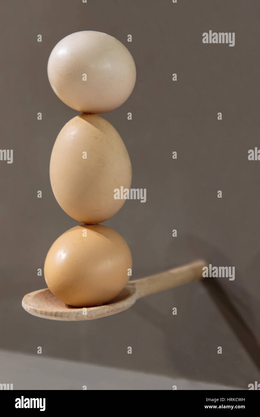 Three eggs vertical position spoon hi-res stock photography and images ...