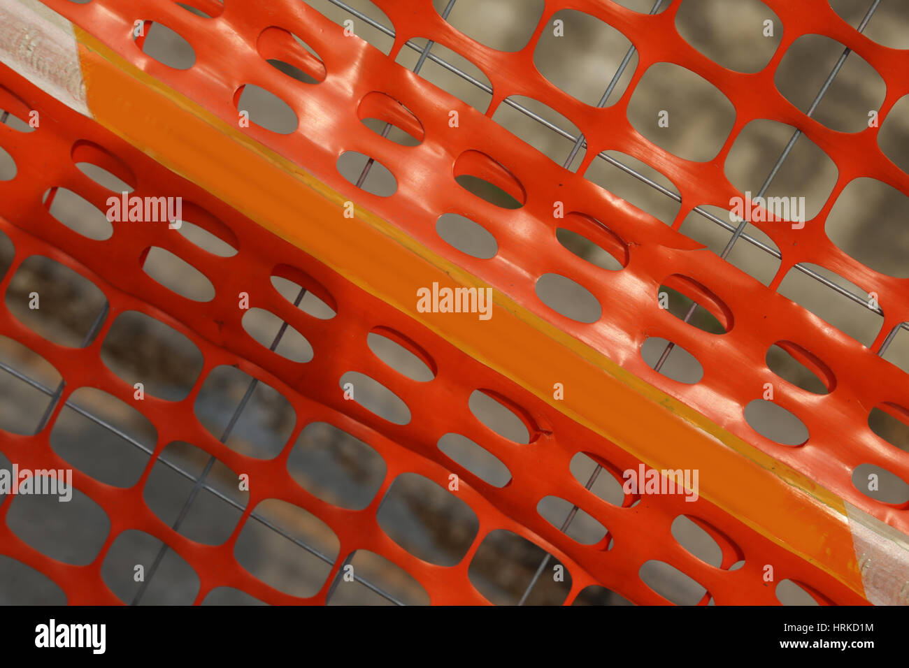 Plastic orange safety net to delimit the area of a construction site in ...