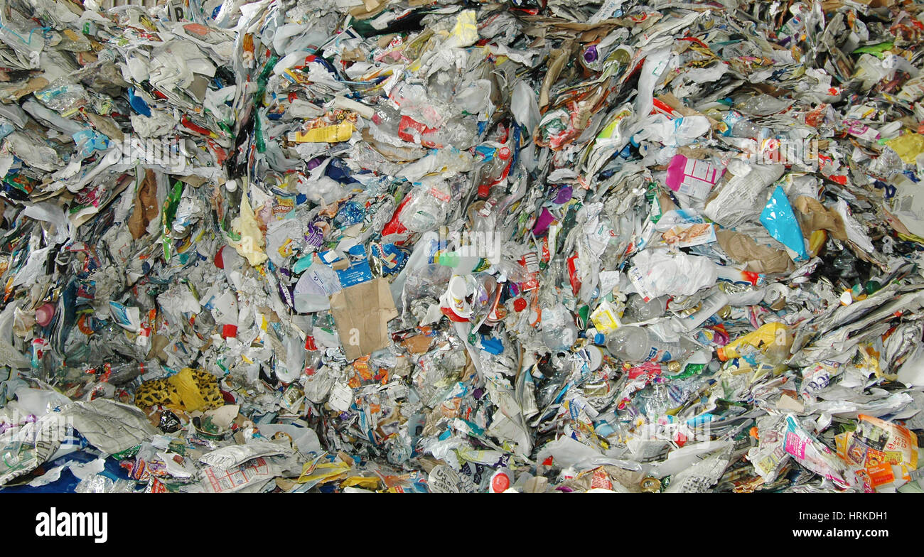 Waste materials including plastic bottles and paper packaging collected ...