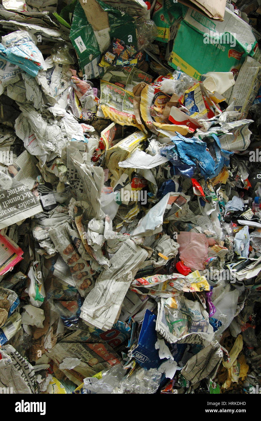 Waste materials including plastic bottles and paper packaging collected ...