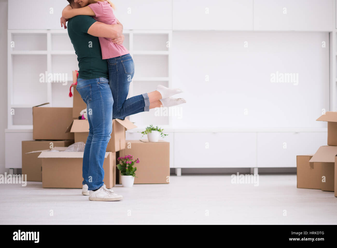excited happy young couple looking forward to moving into a new home ...