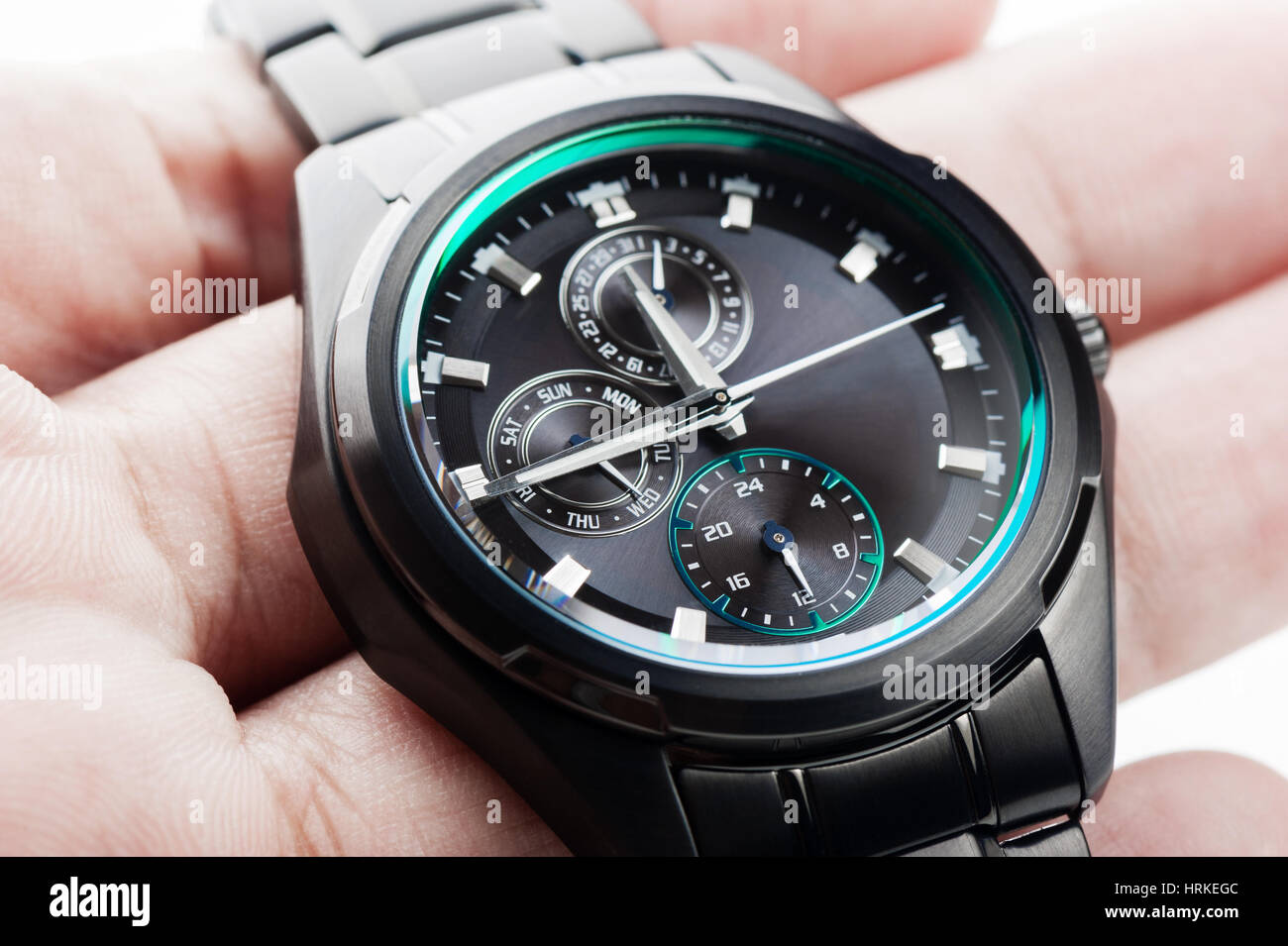 closeup black men watch in hand over white background Stock Photo - Alamy