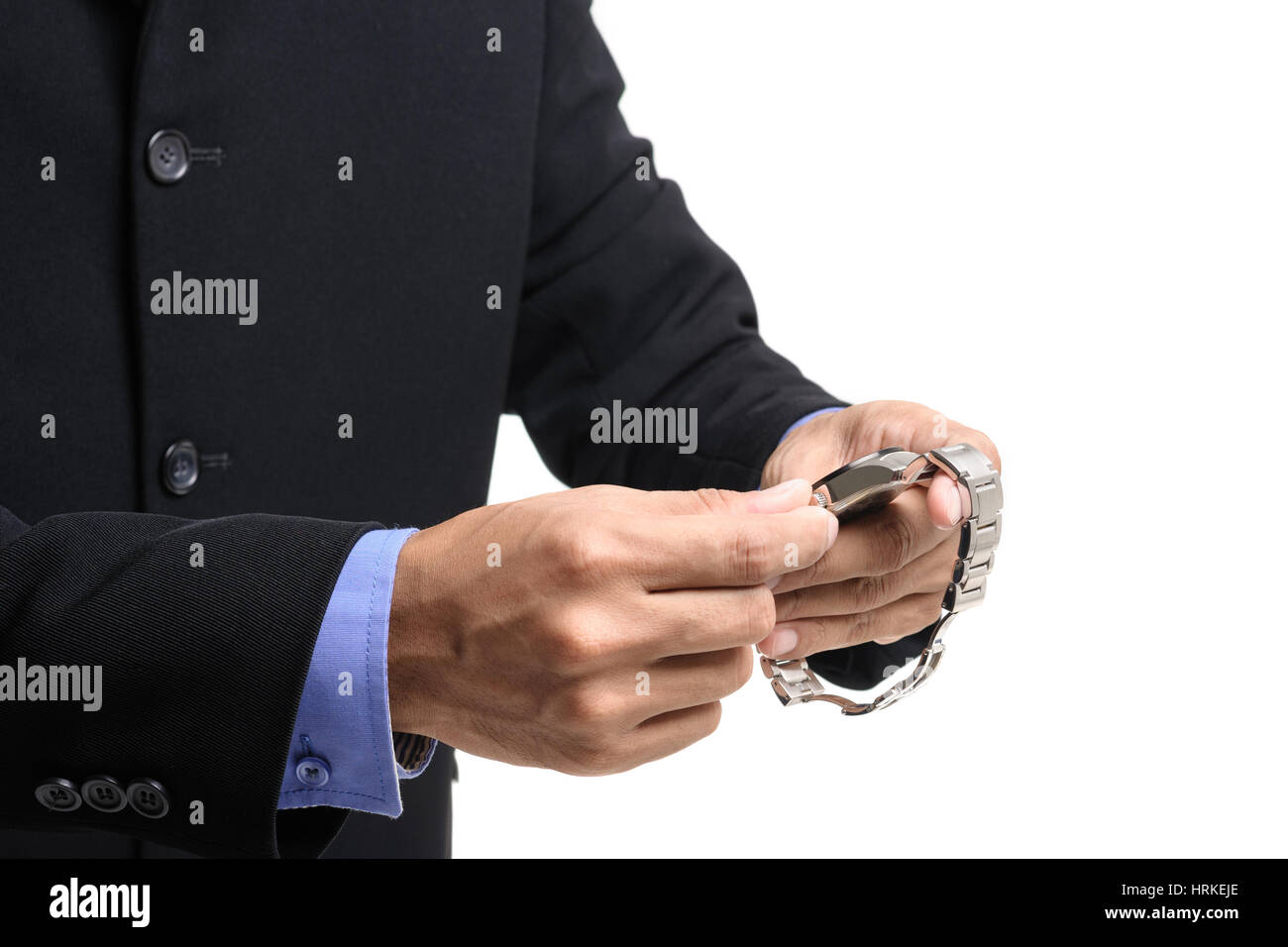 businessman adjusting the time on his watch Stock Photo - Alamy