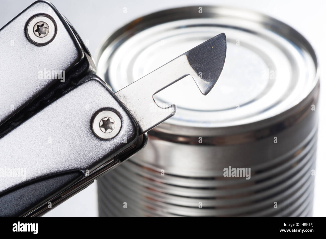 Opening can with knife hi-res stock photography and images - Alamy