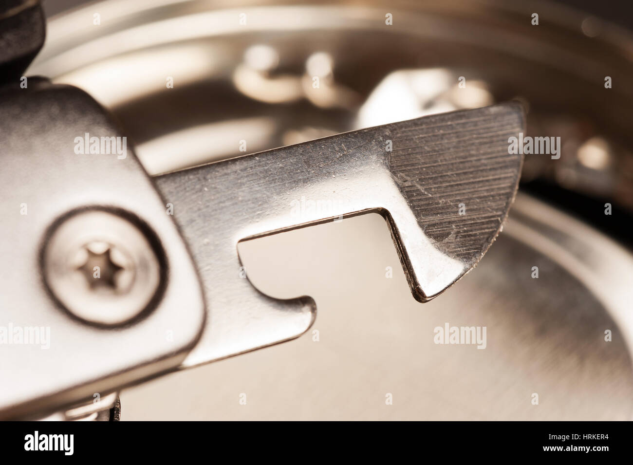 opening the tin with tin opener (can opener Stock Photo - Alamy