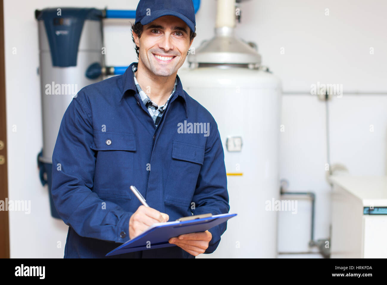 Man fixing water heater hi-res stock photography and images - Alamy