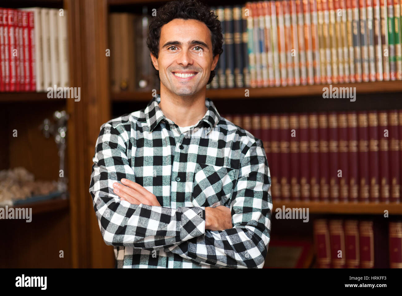 Man in a library Stock Photo - Alamy