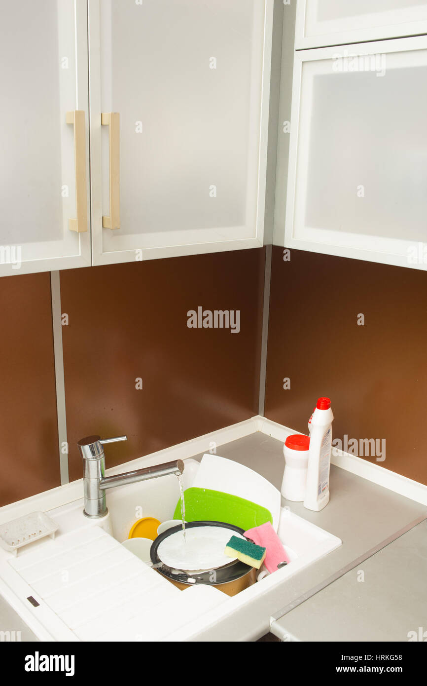close up hands of Woman Washing Dishes in the kitchen Stock Photo - Alamy