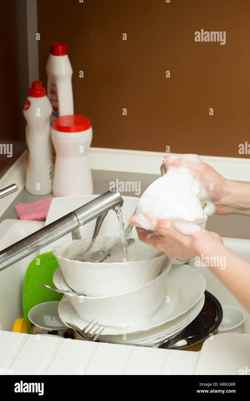 close up hands of Woman Washing Dishes in the kitchen Stock Photo - Alamy