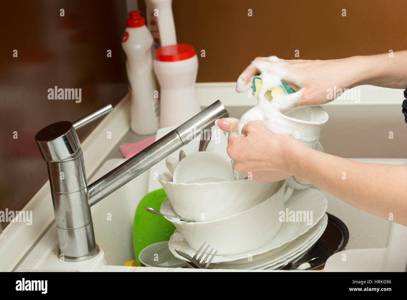 close up hands of Woman Washing Dishes in the kitchen Stock Photo - Alamy