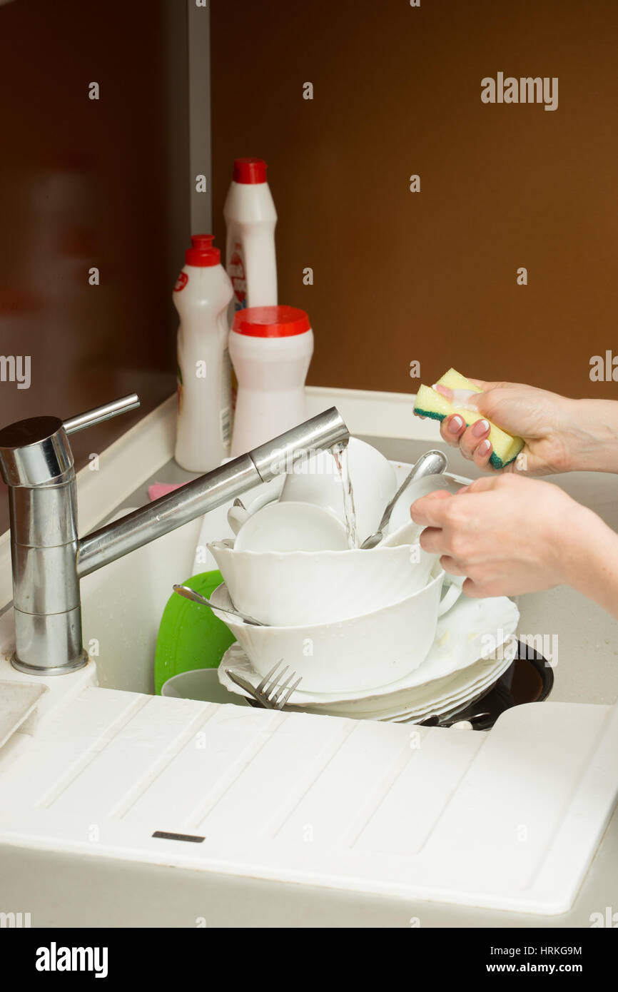 close up hands of Woman Washing Dishes in the kitchen Stock Photo - Alamy