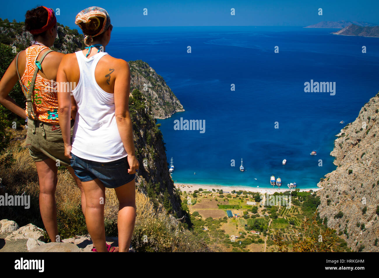 Young women and Coastline landscape. Butterfly Valley, Faralya, Lycian ...
