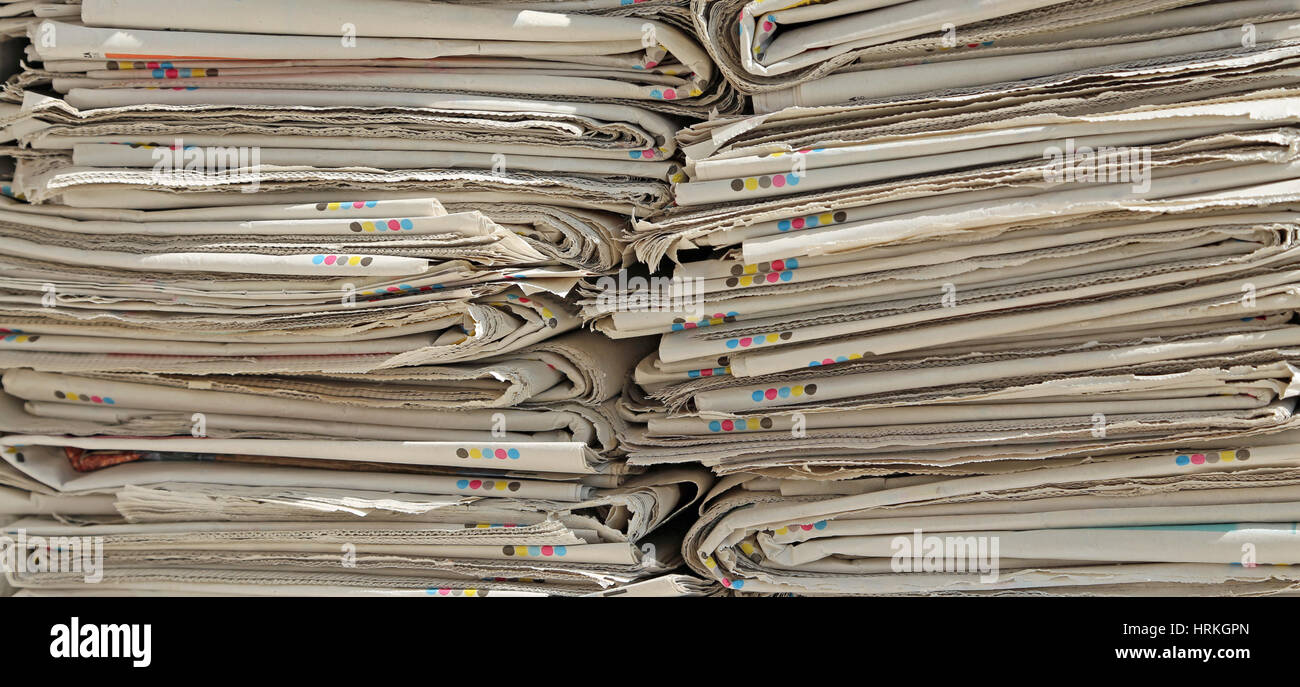 piles of paper used and already read newspapers ready for the paper ...