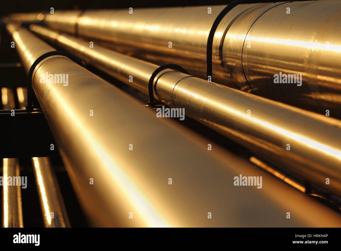 golden steel pipe line conection in crude oil factory Stock Photo - Alamy