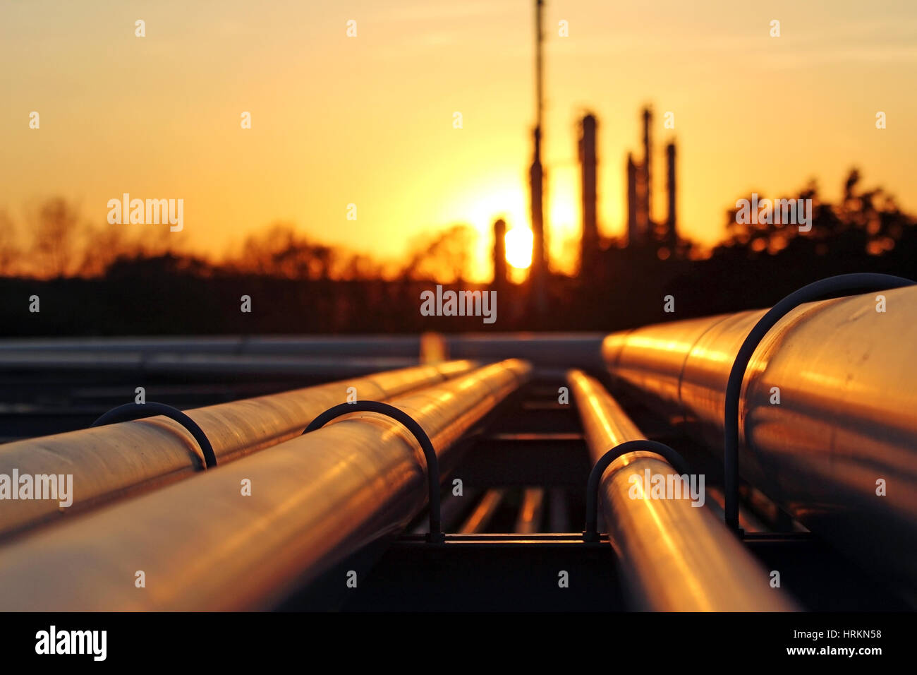 crude oil refinery during sunset with pipeline conection Stock Photo ...