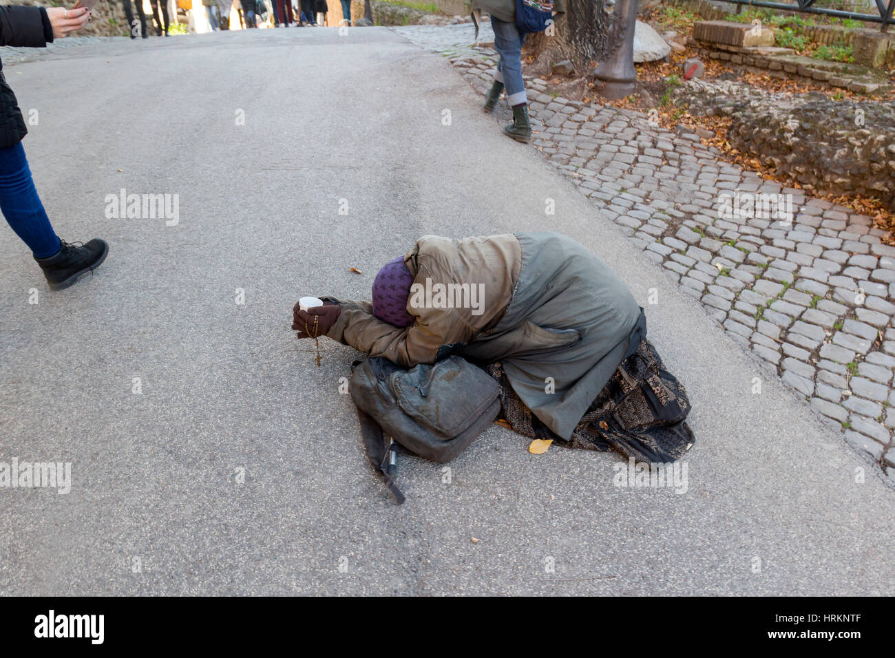 A beggar on the street in Rome, Italy Stock Photo - Alamy