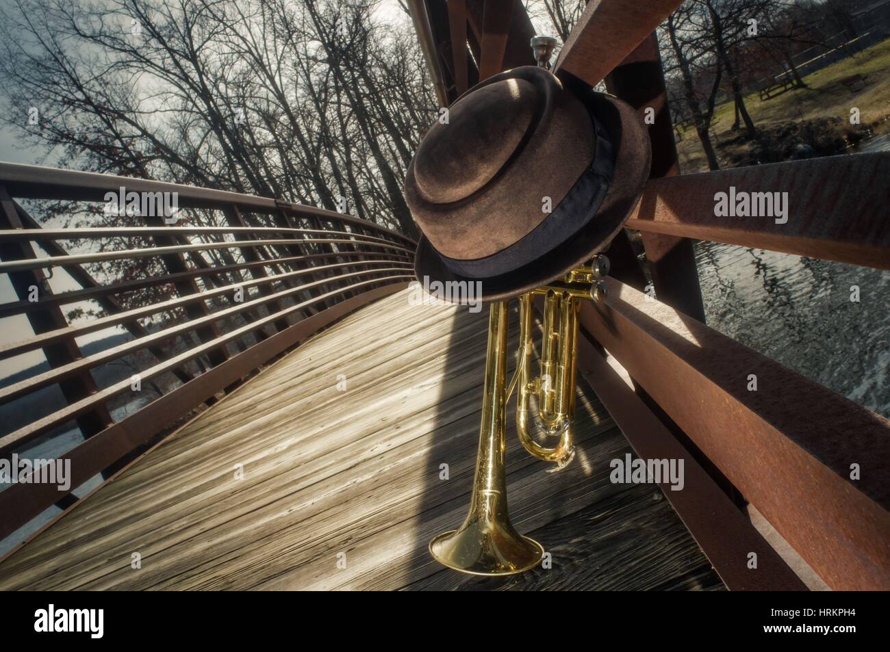 Old worn trumpet with pork pie hat on bridge Stock Photo - Alamy