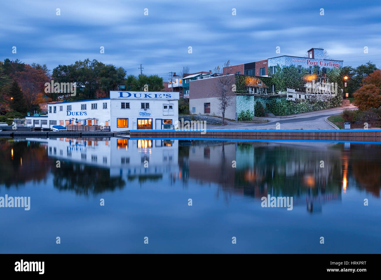 Duke Boats Limited and a mural on Lake Muskoka at dusk in Port Carling ...