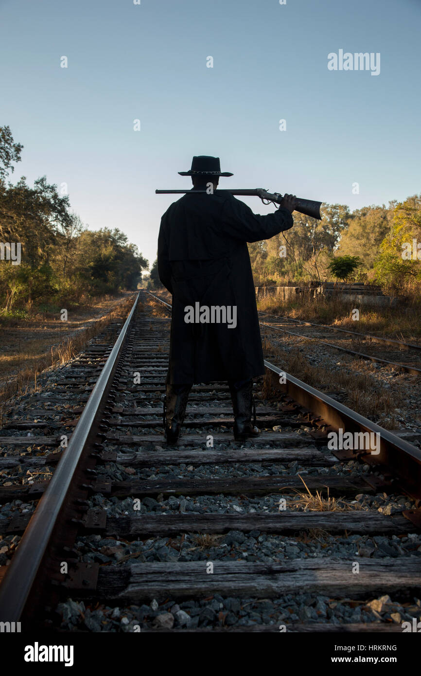 Cowboy with rifle hi-res stock photography and images - Alamy