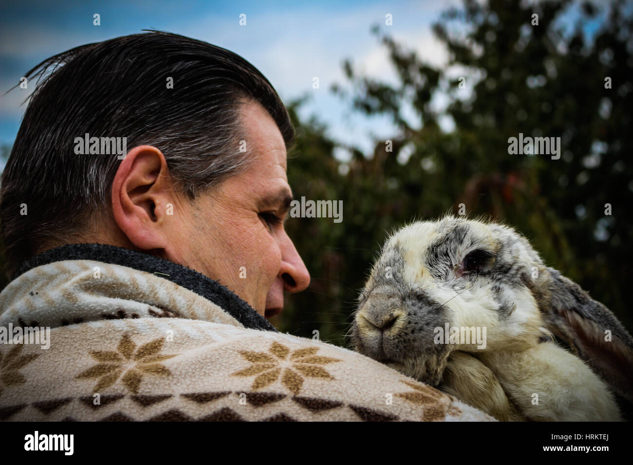 A man and his pet bunny Stock Photo - Alamy