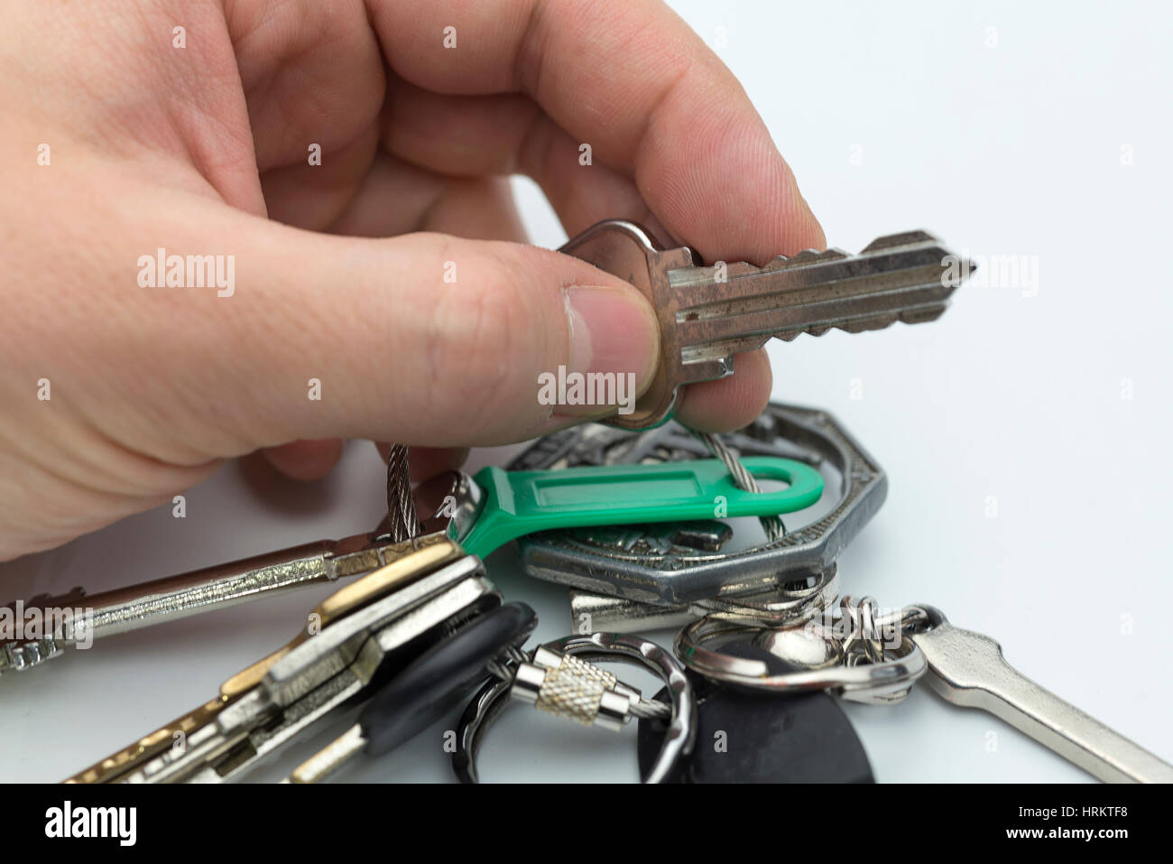 Hand holding keys hi-res stock photography and images - Alamy