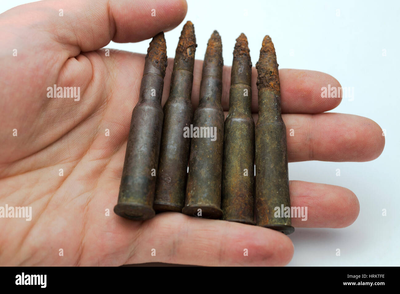 Hand holds the old cartridges on a white background Stock Photo - Alamy