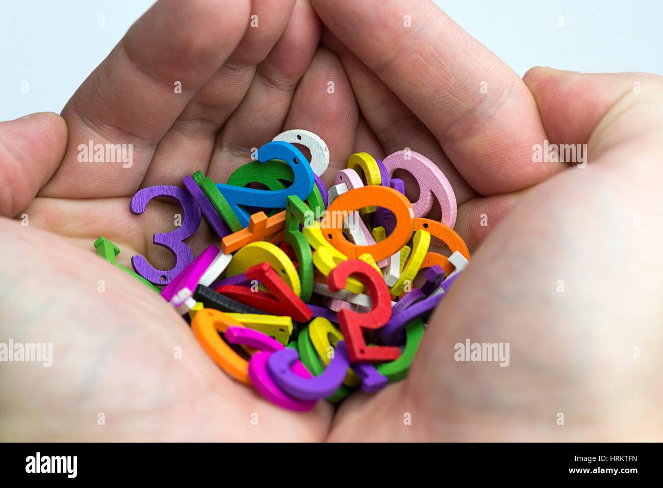 Hands holding the numbers on a white background Stock Photo - Alamy