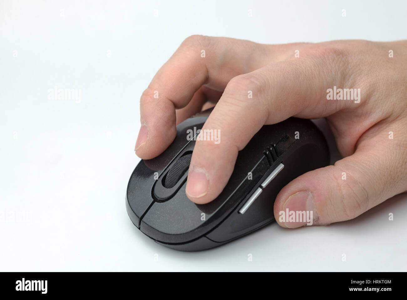 Hand holds a computer mouse on a white background Stock Photo - Alamy
