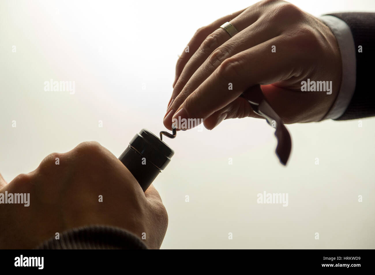 Opening a bottle of wine with cork Stock Photo - Alamy