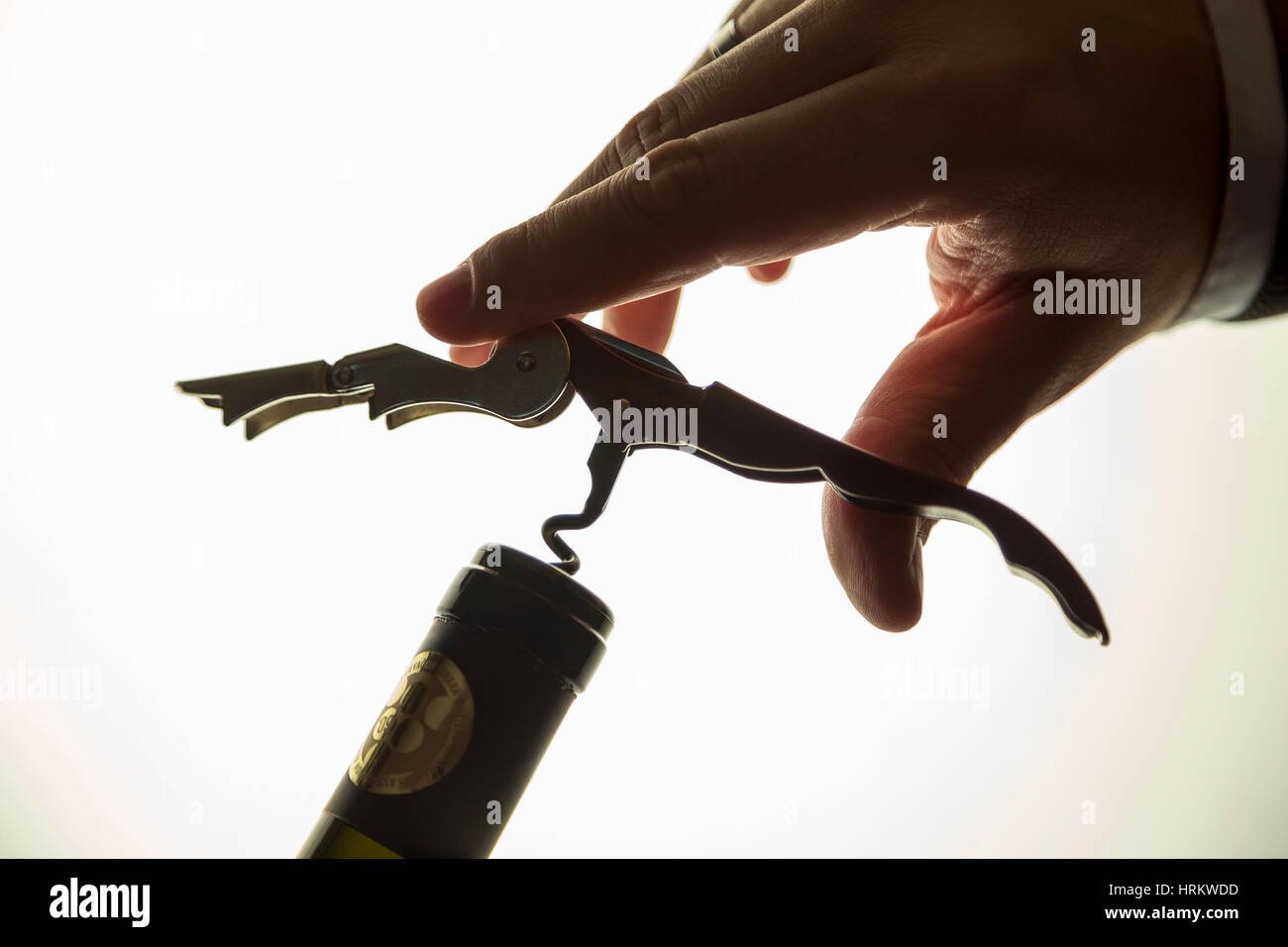 Opening a bottle of wine with cork Stock Photo - Alamy