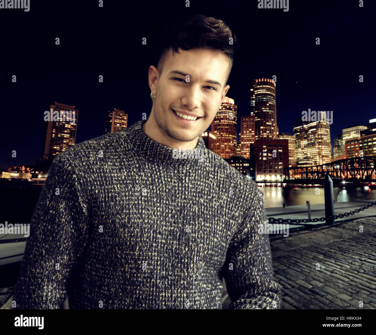Young Man Standing in City Street at Night Stock Photo - Alamy