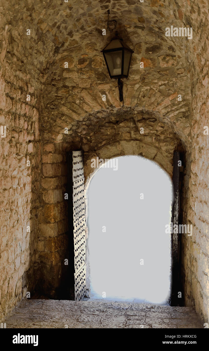 Ancient stone door that leads to the light Stock Photo - Alamy