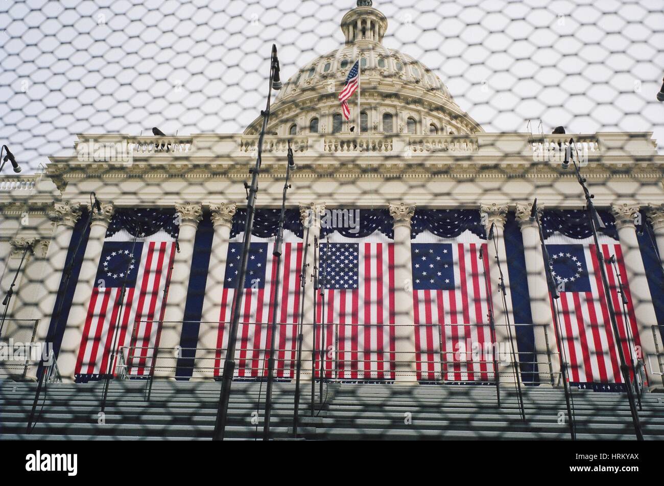 Front of the United States Capitol building with flags seen through ...