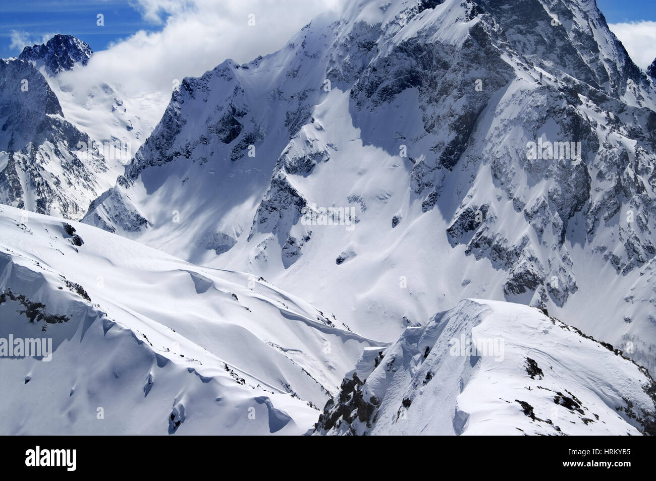 Winter mountains with snow cornice in nice sun day. Caucasus Mountains ...