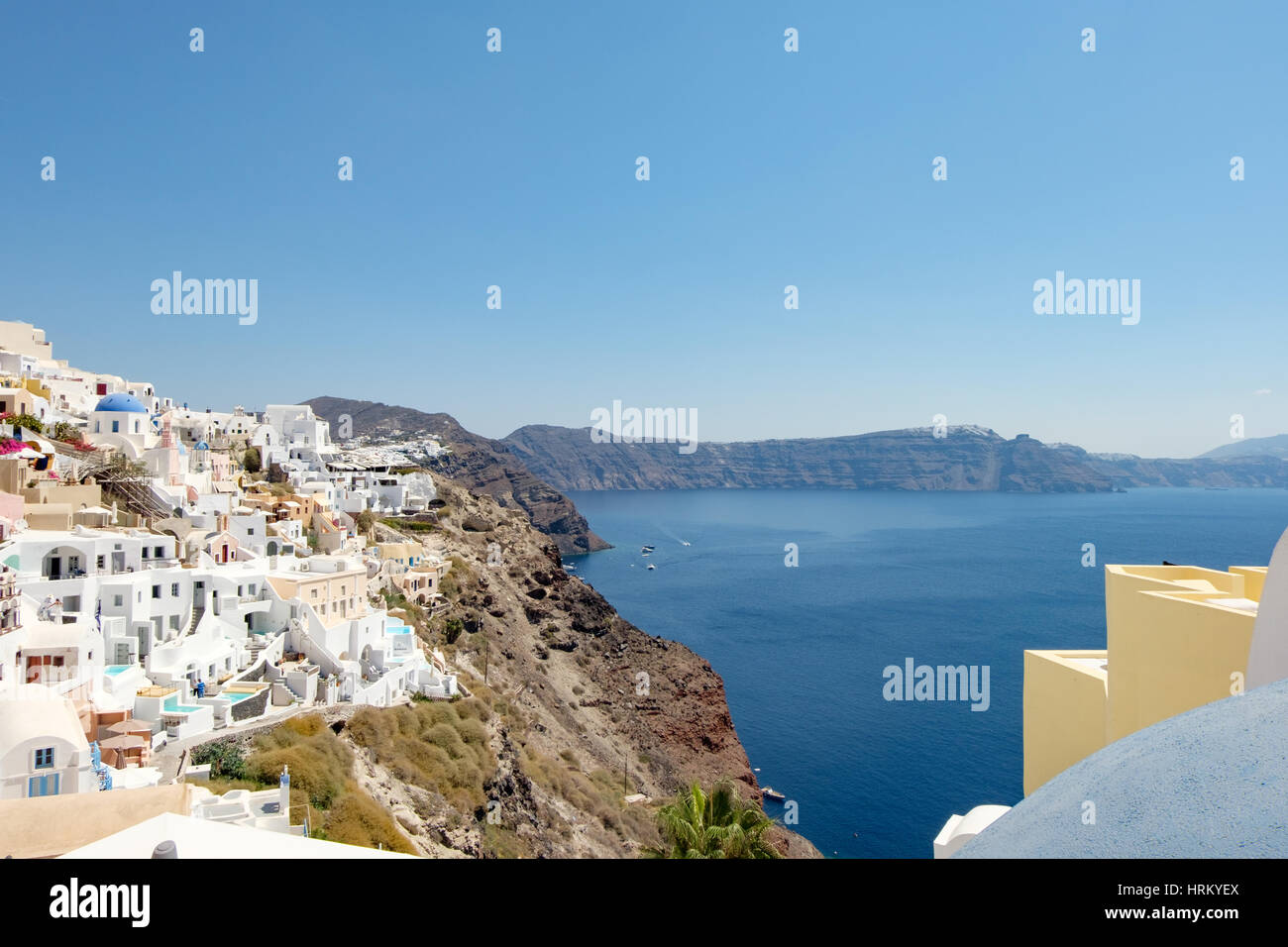 Beautiful view with traditional white buildings over the village of Oia ...