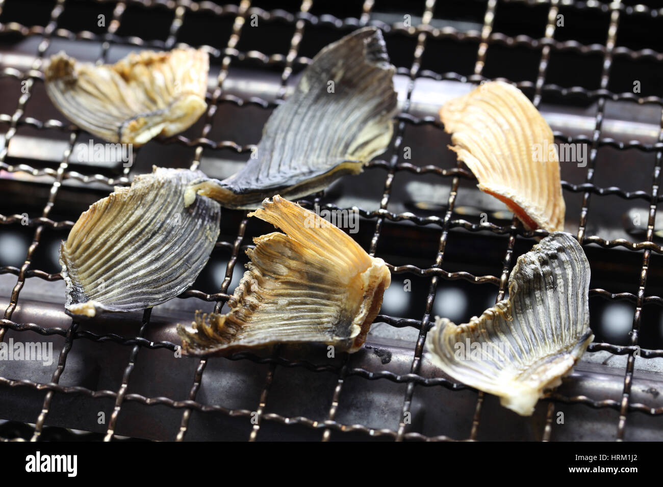 grilling dried blowfish fins for Hirezake (japanese hot sake drink ...