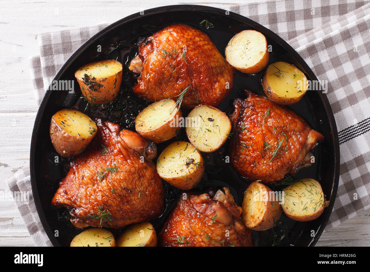 BBQ Food: maple chicken thighs and baby potatoes close-up on a plate ...