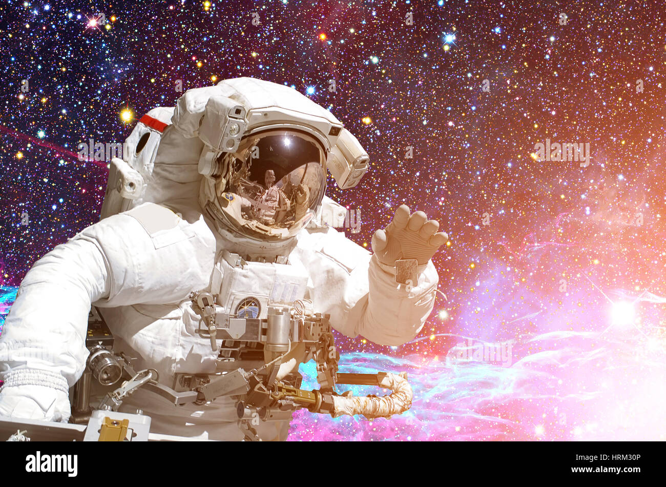 Astronaut in outer space. Galaxy and stars on the background. Elements ...