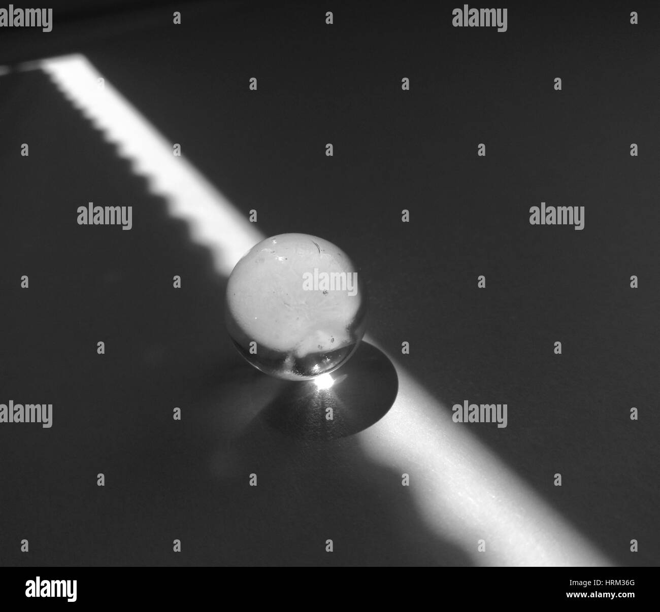 Extreme close up of glass ball with light and shadow Stock Photo - Alamy