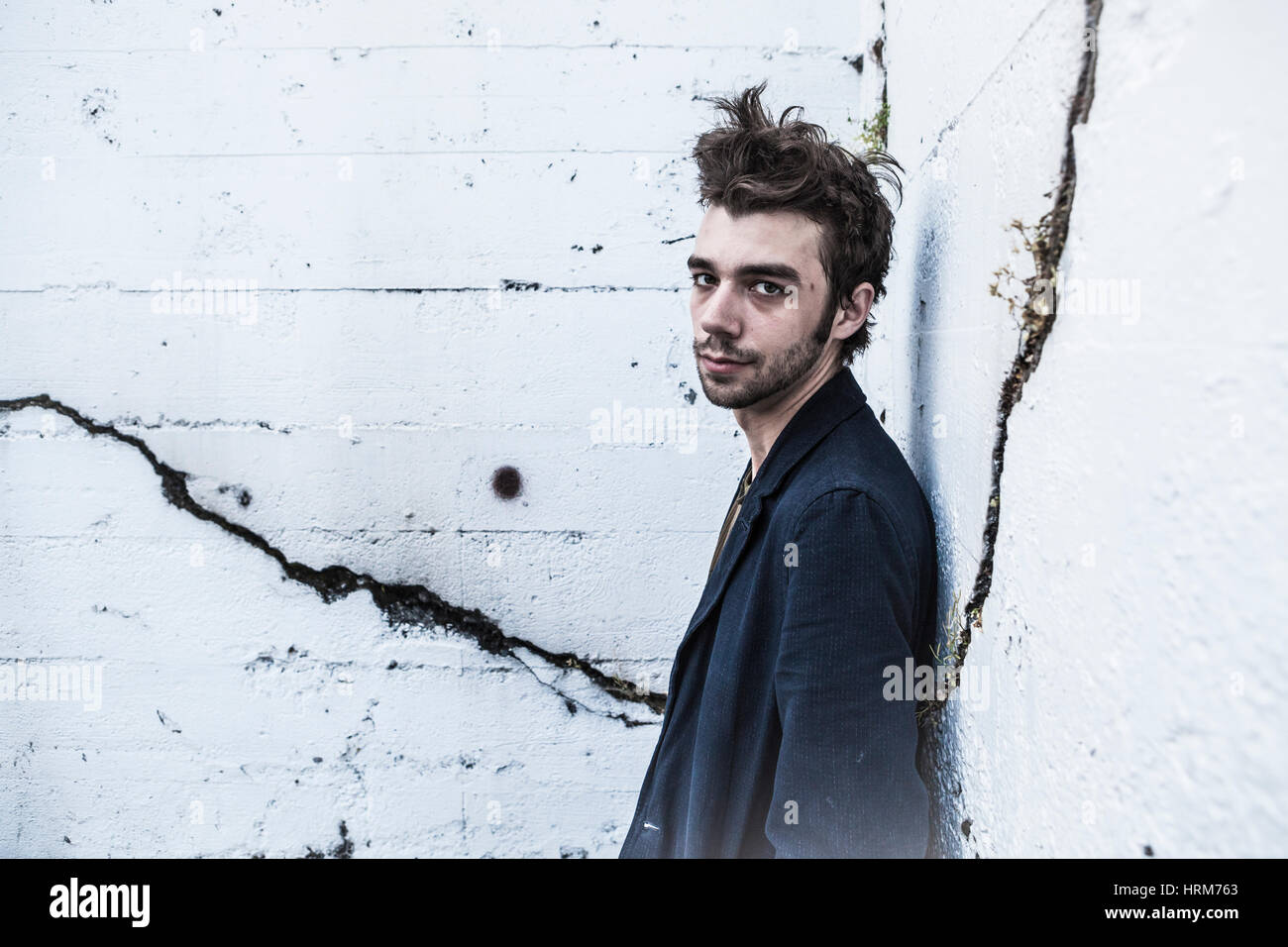A closeup portrait of a serious looking young man Stock Photo - Alamy