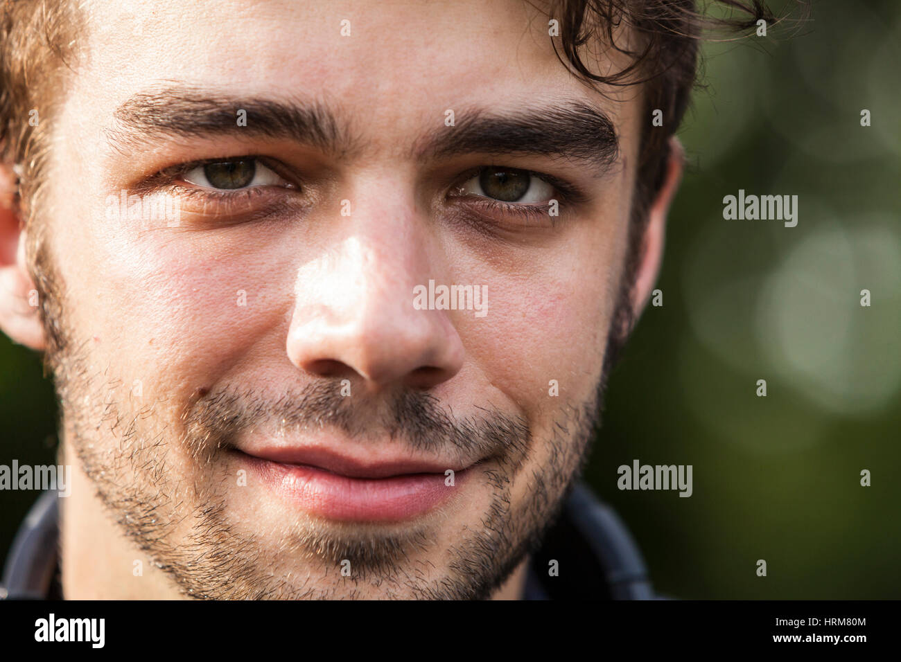 A closeup portrait of a slightly scruffy young man Stock Photo - Alamy