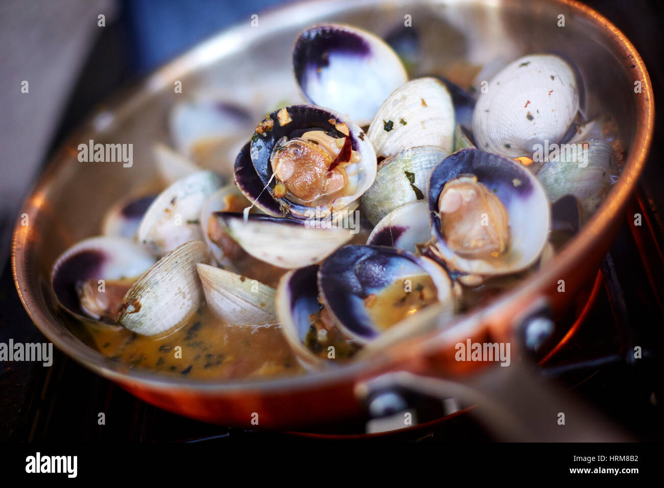 Cockles sautéed in pan Stock Photo - Alamy